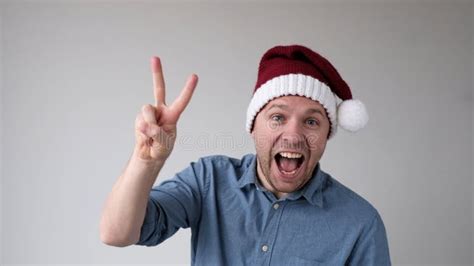 Funny Man In A New Year S Hat Counts Fingers Like Shows Numbers Stock