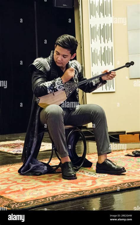 Kazakhstan Almaty Young Musician Playing The Dombra A Traditional