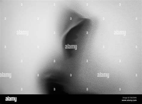 Shadow Blur Of Horror Man In Jacket With Hooddangerous Man Behind The