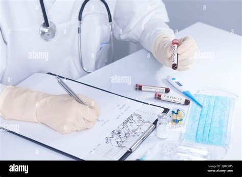 Doctor Hands Holding Covid 19 Coronavirus Test Blood Making Statistical