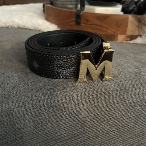 MCM BELT- Black and Gold 110 cm - Depop