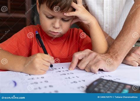 A Boy With Dyscalculia And Dysgraphia Tries To Complete His Math