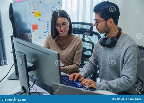 Asian And Indian Developer Team Discussion Feedback Analysis Coding Data With Software Computer