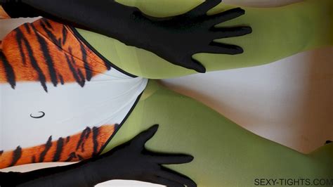 Solo Hottie Loves Posing In Her Tight Tiger Outfit And Green Tights Photos