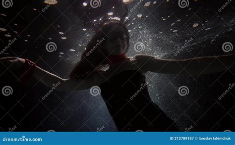 Voluptuous Woman With Mysterious Mask On Face Is Striking Her Body By