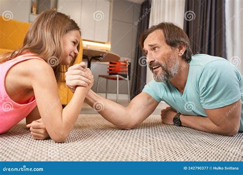Girl Trying To Defeat Man In Arm Wrestling In Game Stock Image Image