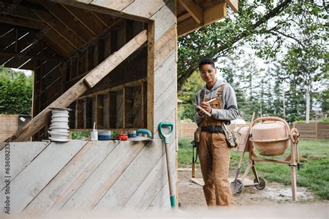 Skilled Carpenter At Work Using Wood And Tools For Her Occupati Stock
