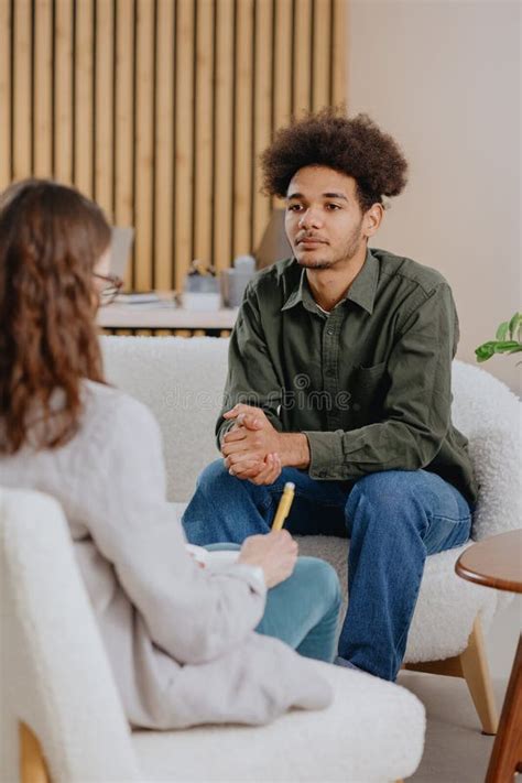 Young Man In Consultation With Psychologist Is Taking Care Of Mental