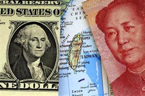A Us Dollar Bill And A Yuan Chinese Banknote On Top Of A Map Showing