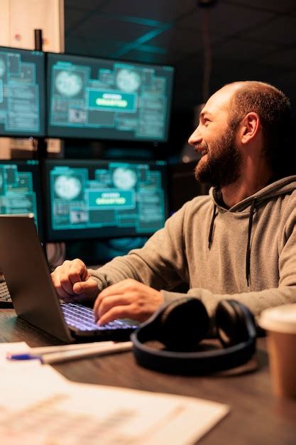 Premium Photo Male Hacker Stealing Computer Data From Server Wearing