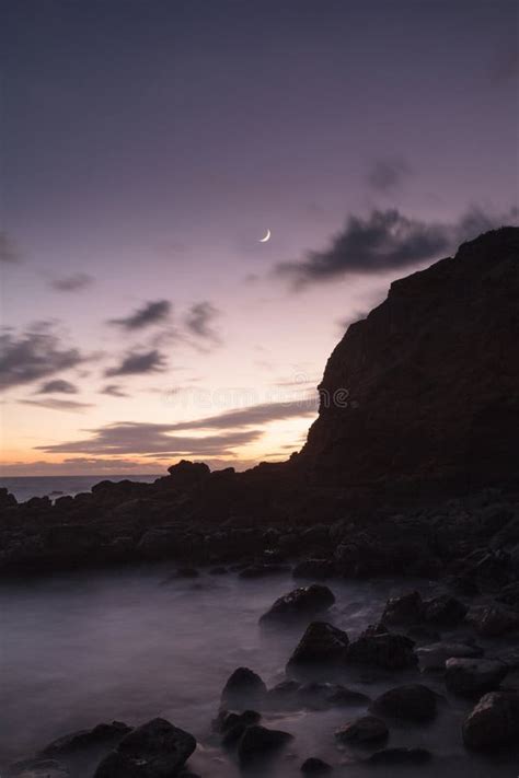 Moonset And Sunset At Crescent Bay Beach In Laguna Beach Stock Image