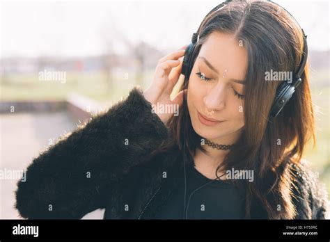 Portrait Of Young Beautiful Caucasian Long Brown Hair Woman With Septum