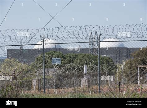 The White Domes Of The Alamaraz Nuclear Power Plant Seen Behind The Grilles Surrounding The