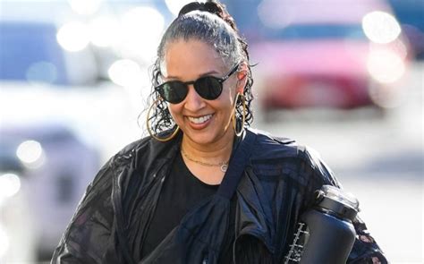Tia Mowry Models Chic Denim On Denim Look With Miniskirt And Clear Pumps