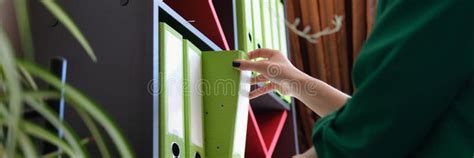 Woman Taking Of Shelf Green Paper Folder Stock Image Image Of Folder