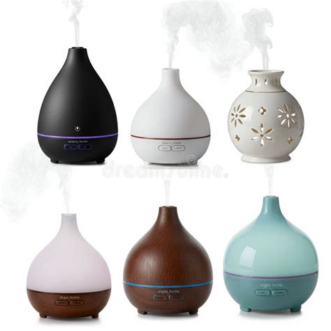 Six Electric Essential Oil Diffusers Each With A Unique Design And Color The Top Row Stock