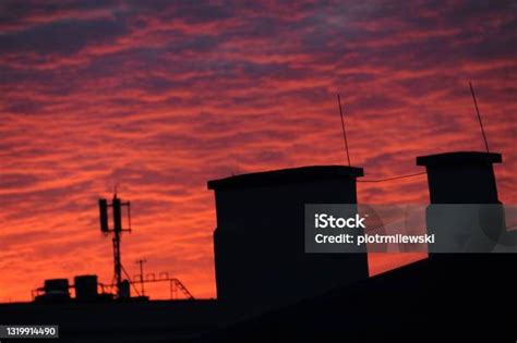 Purple Red And Orange Sky With Dramatc Clouds During Sunset Over The
