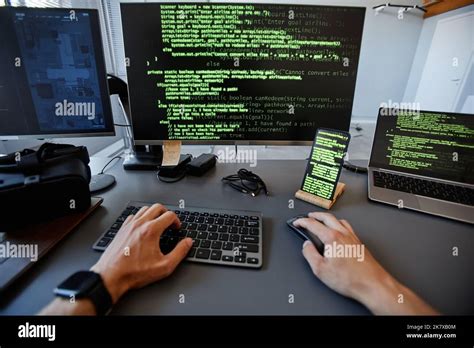 POV shot of computer programmer working with green code lines on multiple device screens, copy ...