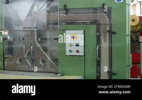 Cigarettes Are Moving Down A Conveyor Belt In A Cigarette Factory
