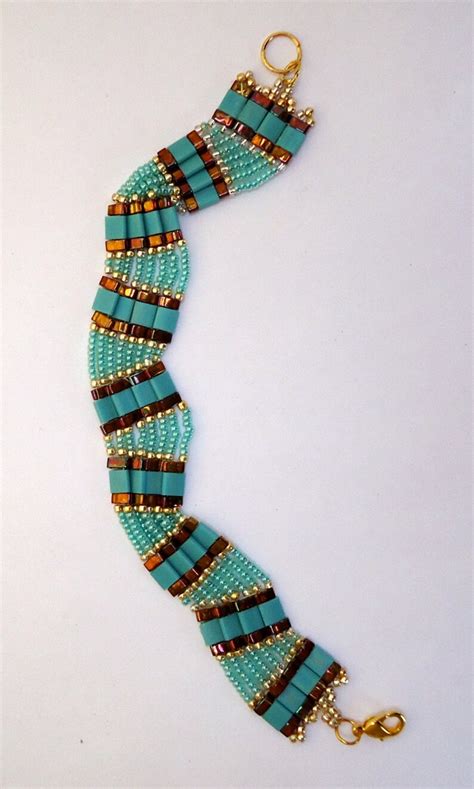 Beaded Bracelet In Shades Of Turquoise And Gold In Zig Zag Pattern With