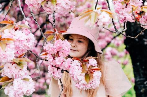 Premium Photo Girl In The Cherry Blossom Garden