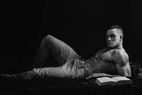 Premium Photo Muscular Shirtless Man In Bedroom Reading Macho Naked In Bed Sex And Relaxation