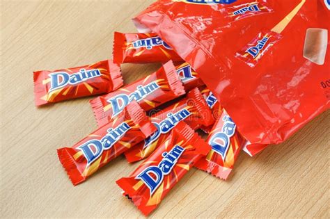 Daim Milk Chocolate And Caramel Candy On A Wooden Table Editorial Stock