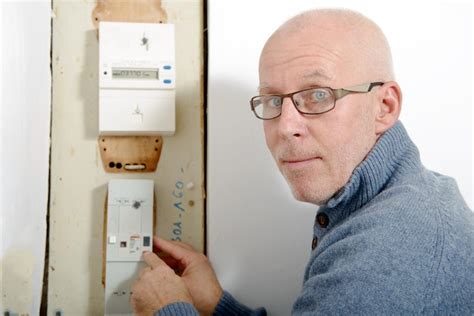 Premium Photo Portrait Of Man Repairing Fuse Box At Home
