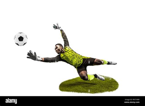 Male Soccer Player Goalkeeper Catching Ball In Jump Silhouette Of Fit