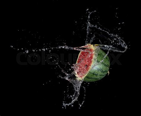 Sliced Watermelon With Water Splash Flying In The Airstop Motion