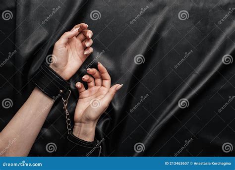 Female Hands In Handcuffs On A Dark Silk Sheet Stock Image Image Of