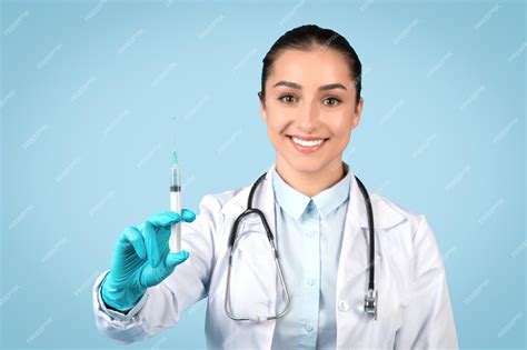 Premium Photo Smiling European Woman Doctor Wearing Sterile Gloves