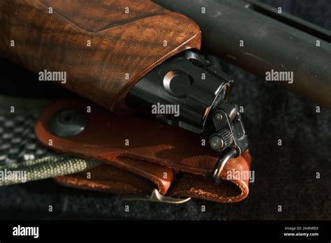 Shell Magazine Into The Barrel Of A Long Shotgun On Dark Background