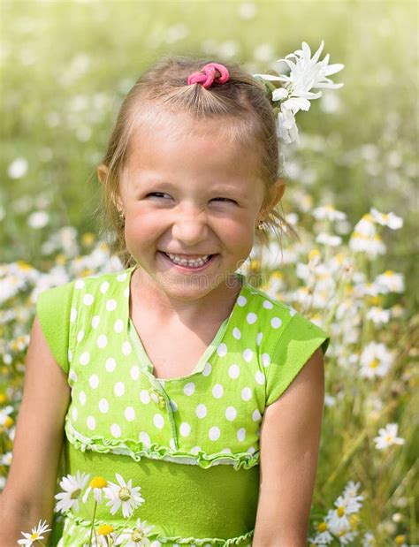 Girl Laughs Among Daisy Flowers Smiling Girl On A Field Of Dais Stock