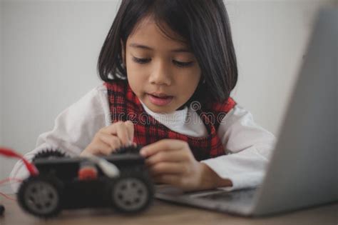 Stem Education Concept Asian Students Learn At Home By Coding Robot