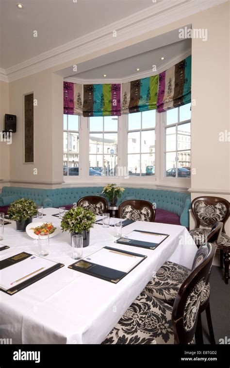 Hotel Meeting Room With The Table Laid Out For A Business Meeting With