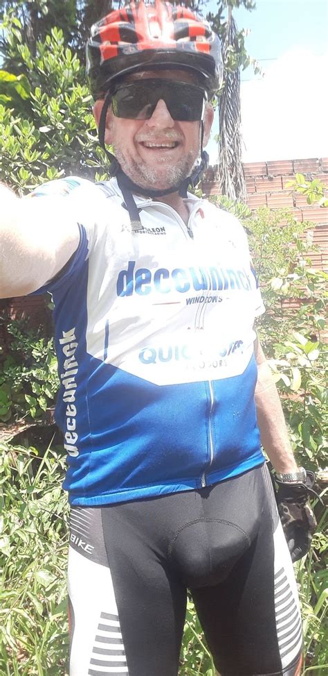 A Man In Cycling Gear Taking A Selfie