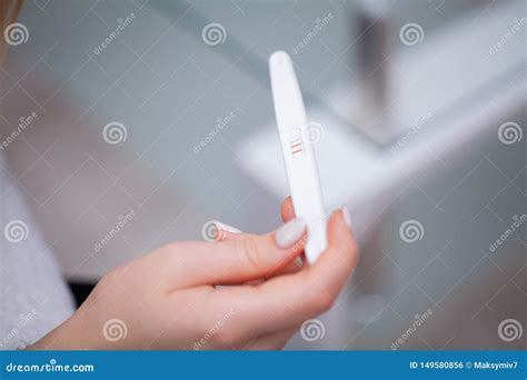 Positive Pregnancy Test Portrait Of Desperate Young Woman Holding