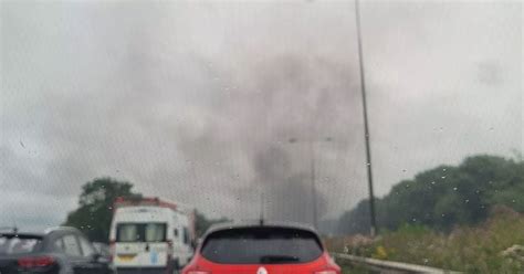 Clouds Of Smoke Billow Across Motorway As Vehicle Becomes Engulfed In