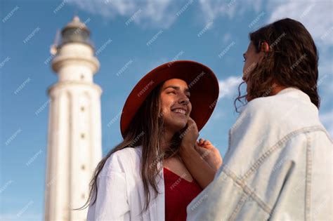 Premium Photo Medium Shot Women Posing With Lighthouse