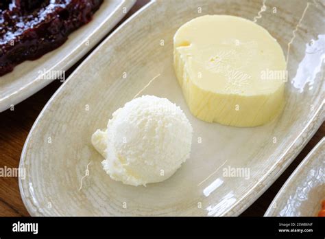 A Scoop Of White Dairy Product And A Portion Of Yellow Dairy Product