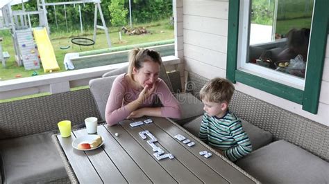 Mother And Sons Playing Dominoes On Terrace Stock Footage Video Of