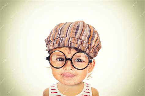 Premium Photo Close Up Portrait Of Cute Girl Sticking Out Tongue