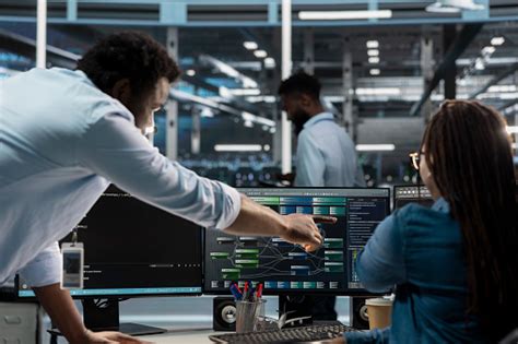 Data Center Supervisor Overseeing Admin Using Pc To Visualize Ai Node