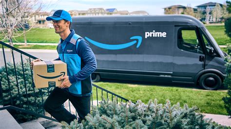 Amazon Prime Delivery Driver Walks Up The Steps To Deliver A Package