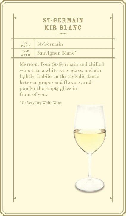 A Glass Of White Wine Sitting On Top Of A Table