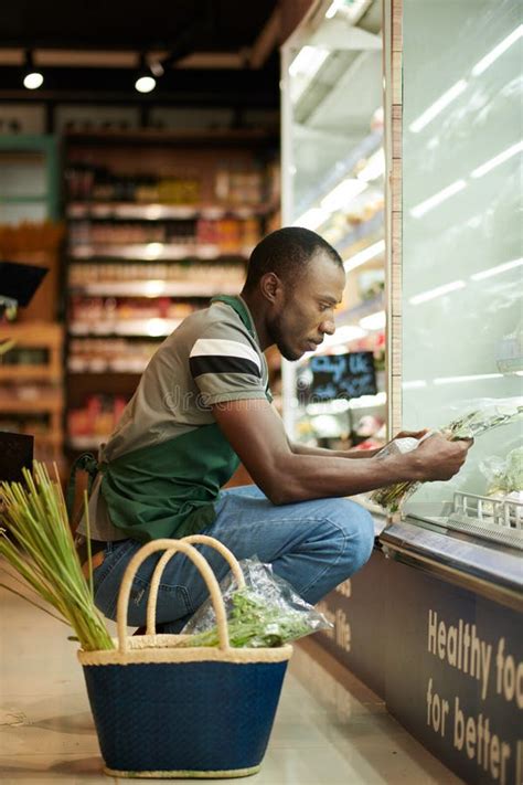 store worker checking expiration date stock image image of apron