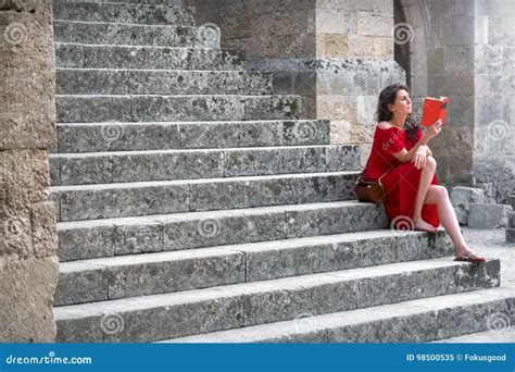 Girl In Red Dress Reading Stock Image Image Of Bachelor 98500535