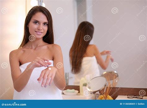Attractive Young Woman Applying Cream On Her Face Stock Image Image