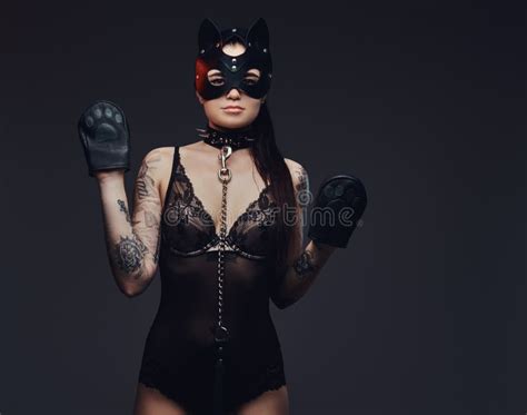 Woman Wearing Black Lingerie In Bdsm Cat Leather Mask And Accessories